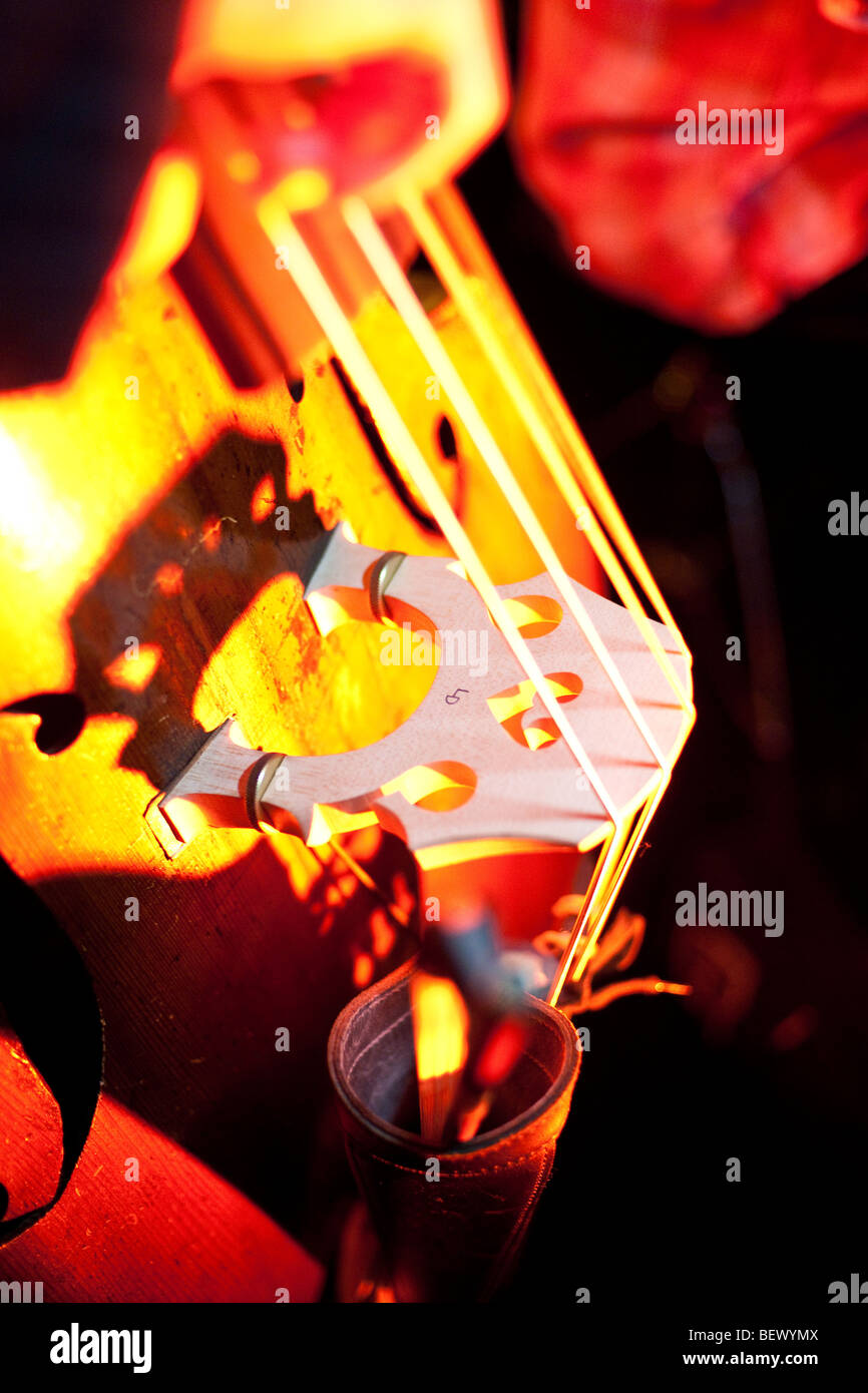 Close-up of the bridge of a double bass being played at a jazz concert ...