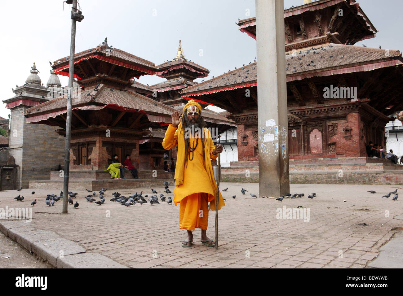 A Sadhu poses with raised hand in blessing at Kathmandu Durbar Square ...