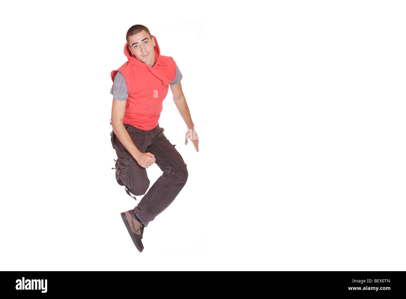A handsome young man jumping isolated on white Stock Photo - Alamy