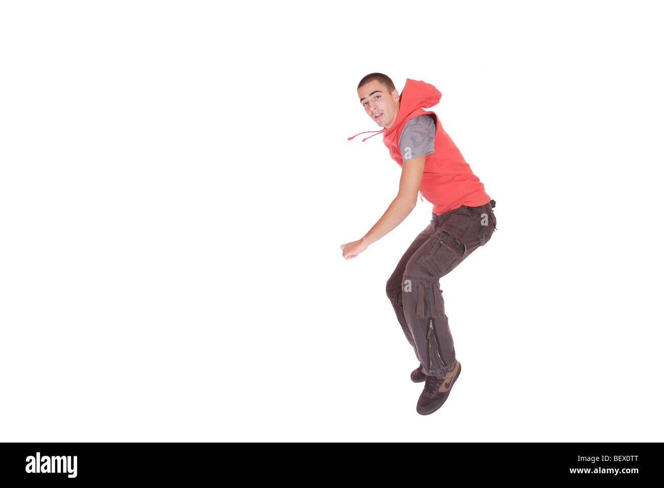 A handsome young man jumping isolated on white Stock Photo - Alamy