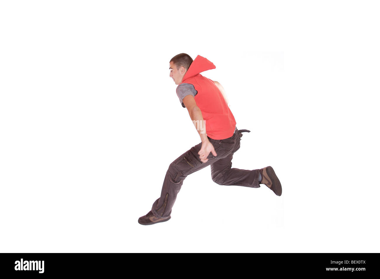 A handsome young man jumping isolated on white Stock Photo - Alamy