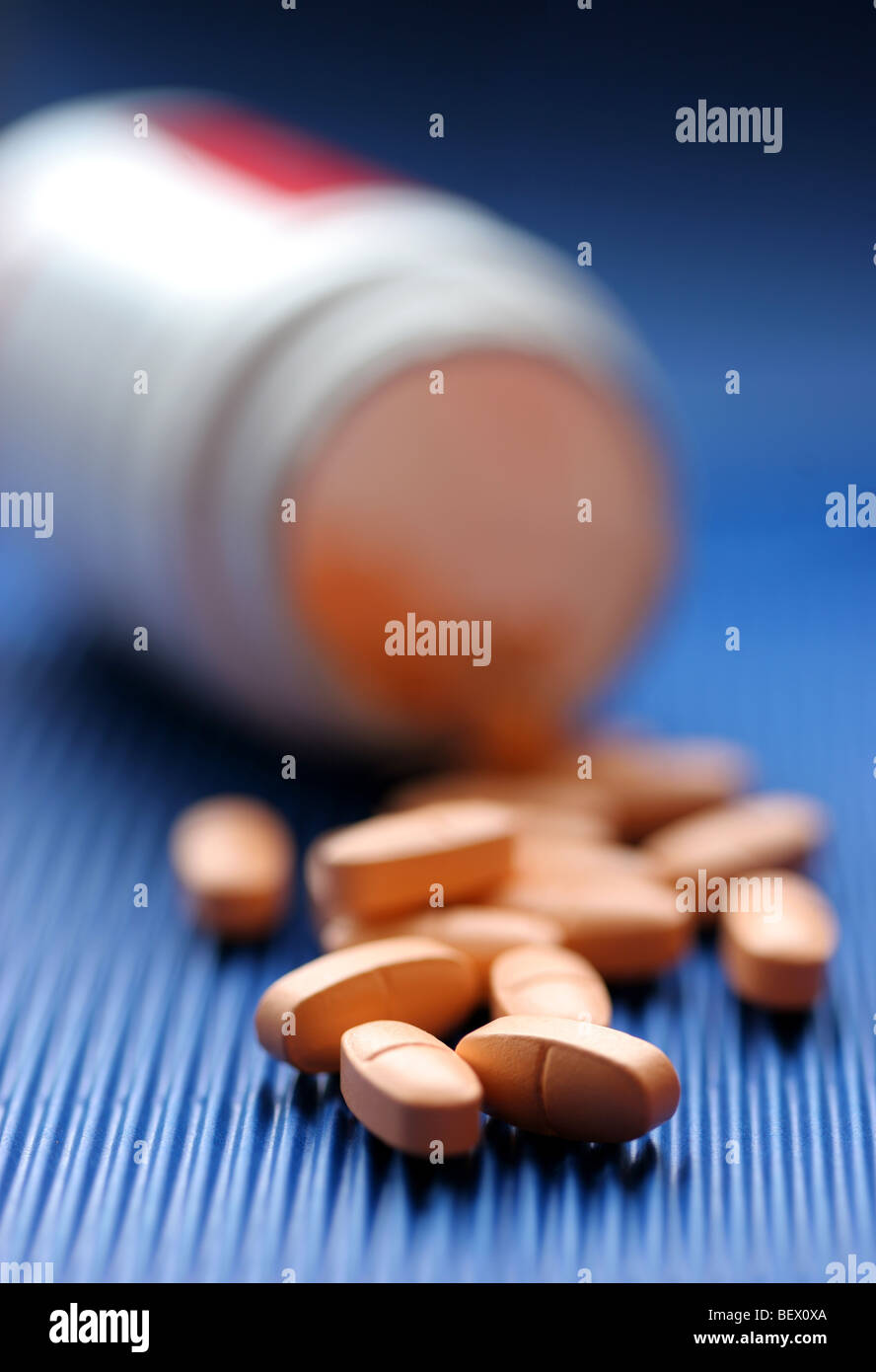 tablets on a blue background Stock Photo - Alamy