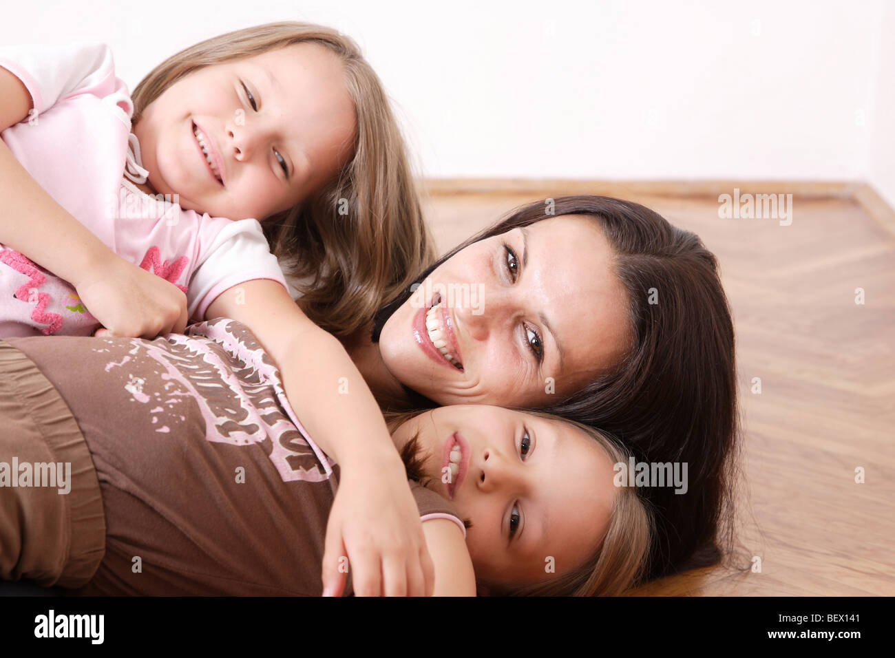 happy family, young beautiful mother and her two little daughters Stock ...