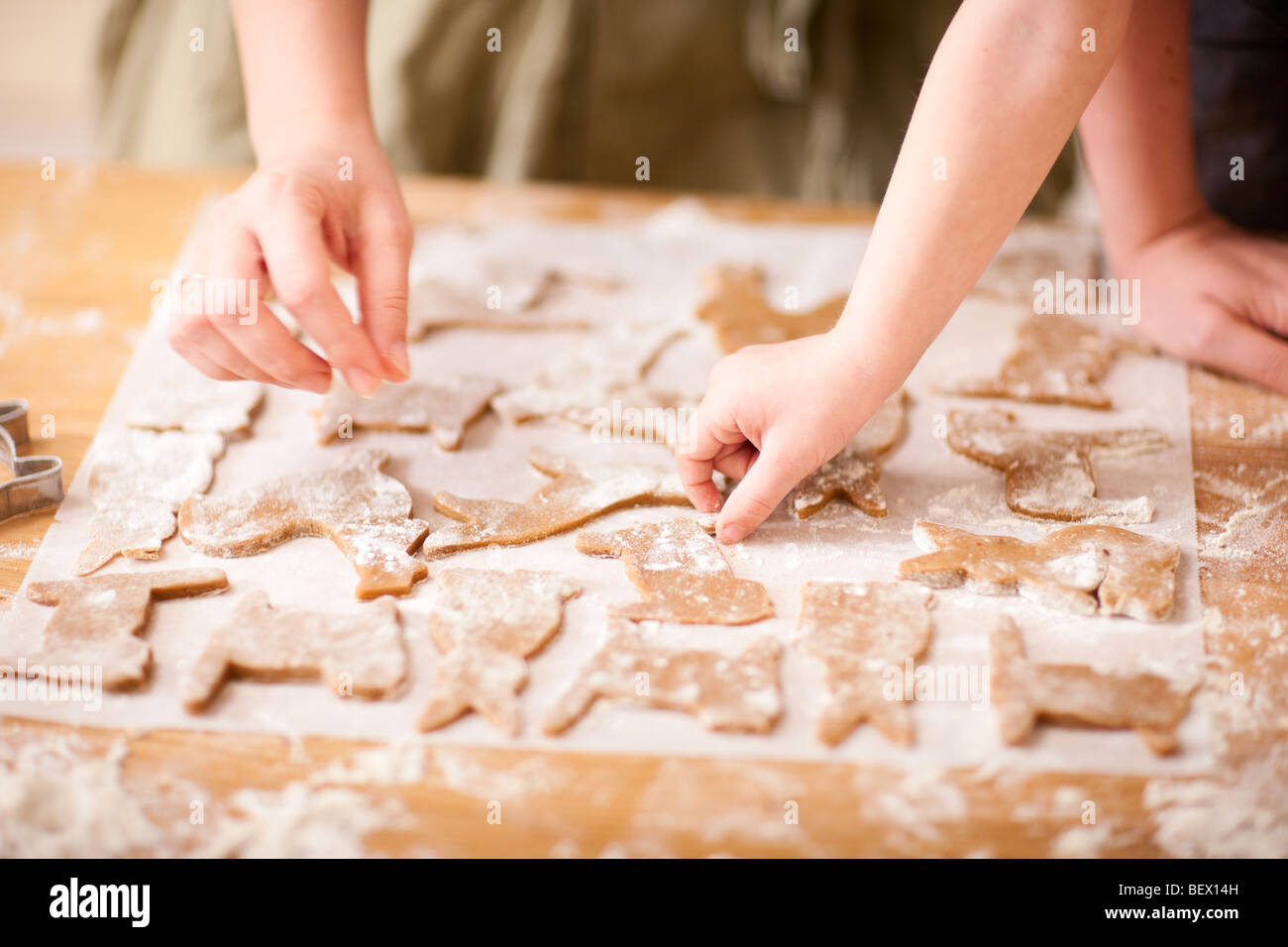 Young mother and son in kitchen making cookies Stock Photo - Alamy