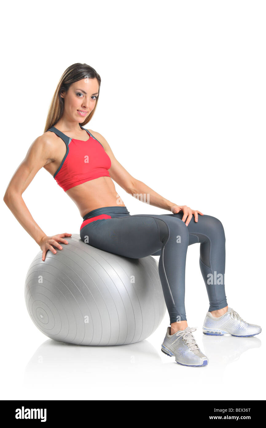 Pilates instructor showing exercise with a ball isolated on white ...