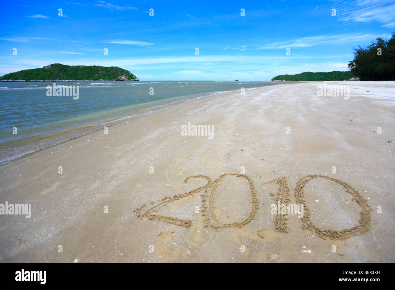 Beautiful tropical beach with number 2010 written on sand Stock Photo ...