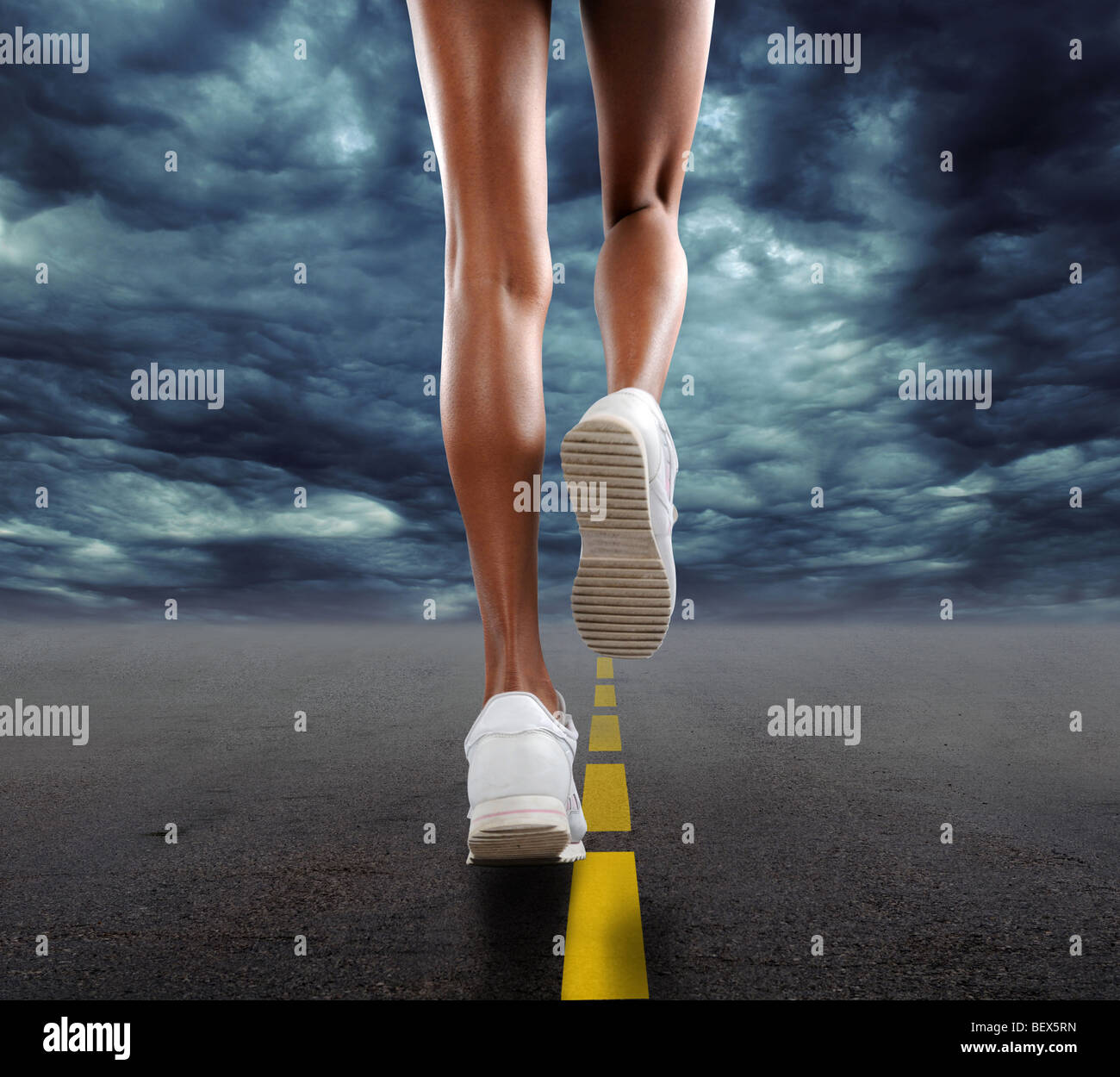 Woman jogging on a stormy day Stock Photo - Alamy