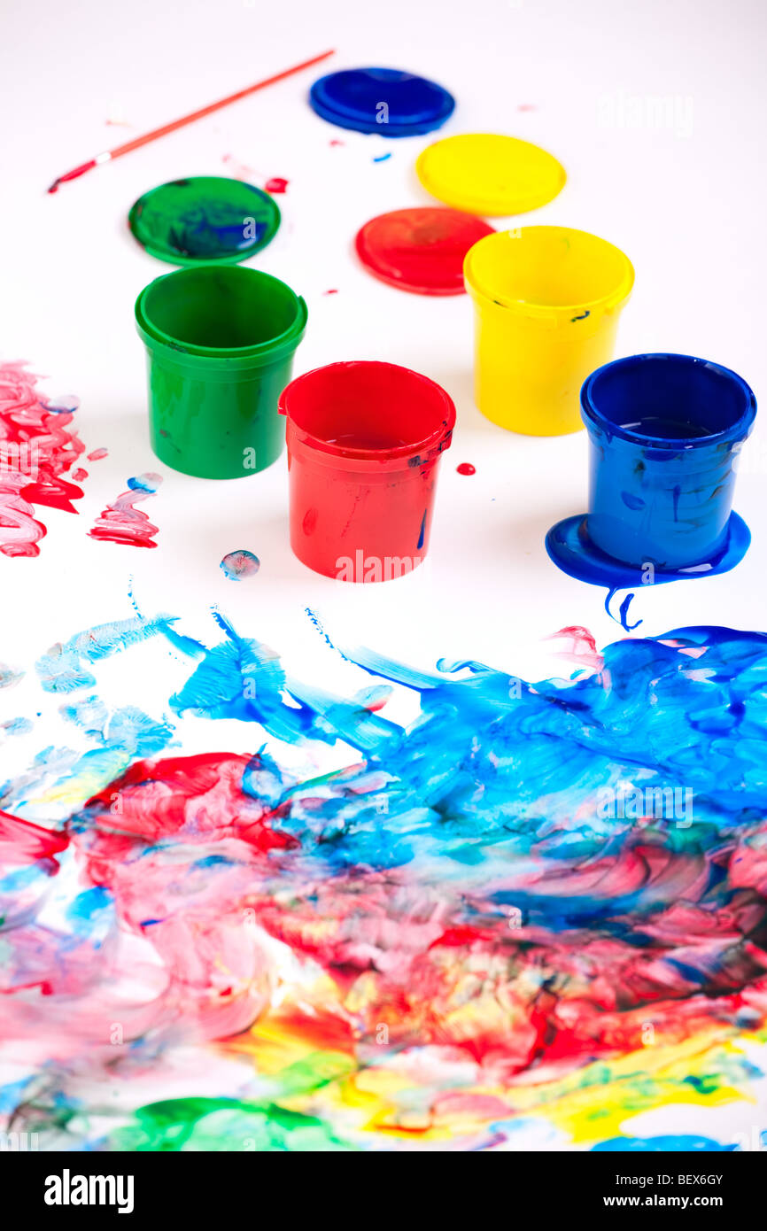 Closeup of colorful finger paints over white background Stock Photo - Alamy