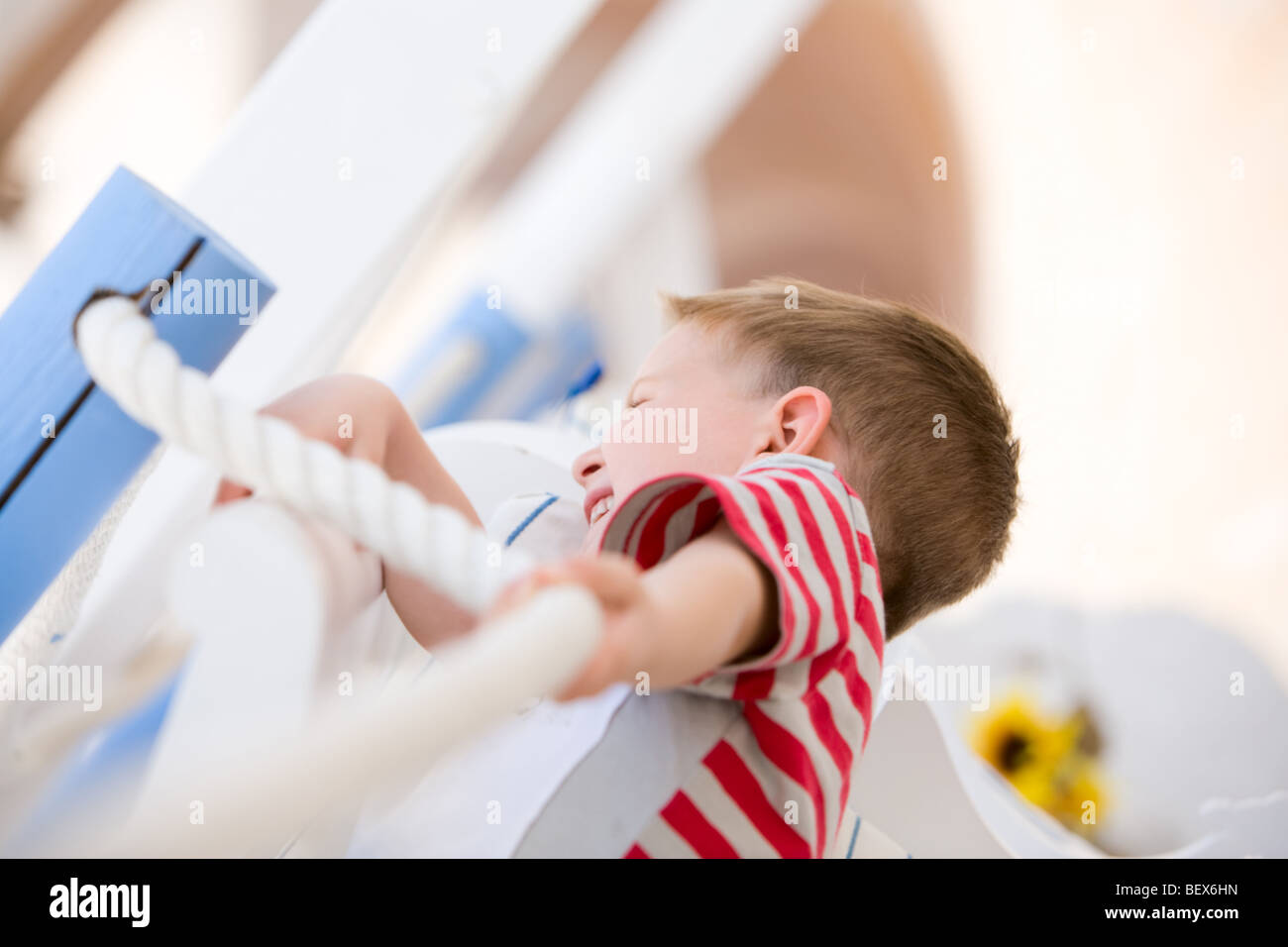 4 years old boy pulling rope Stock Photo - Alamy