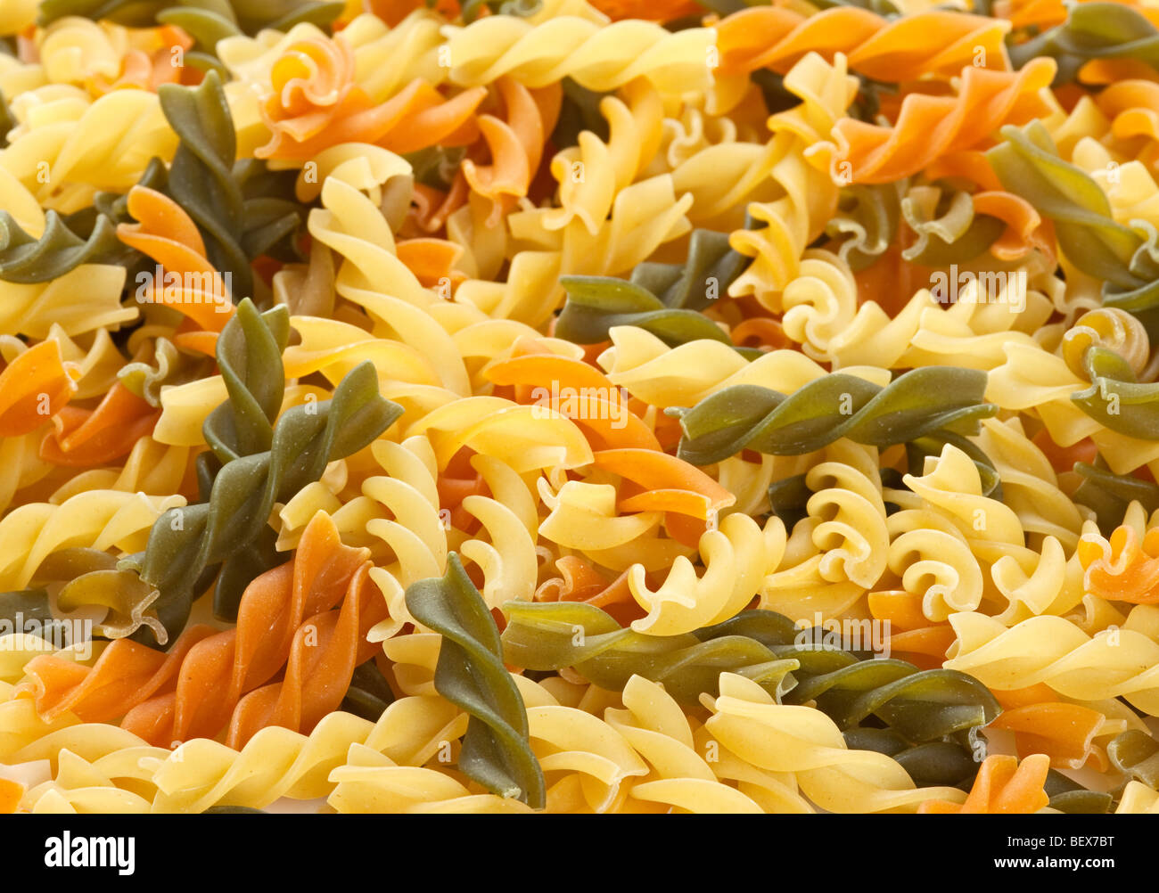 Multicolored pasta with the addition of natural tomatoes and spinach ...