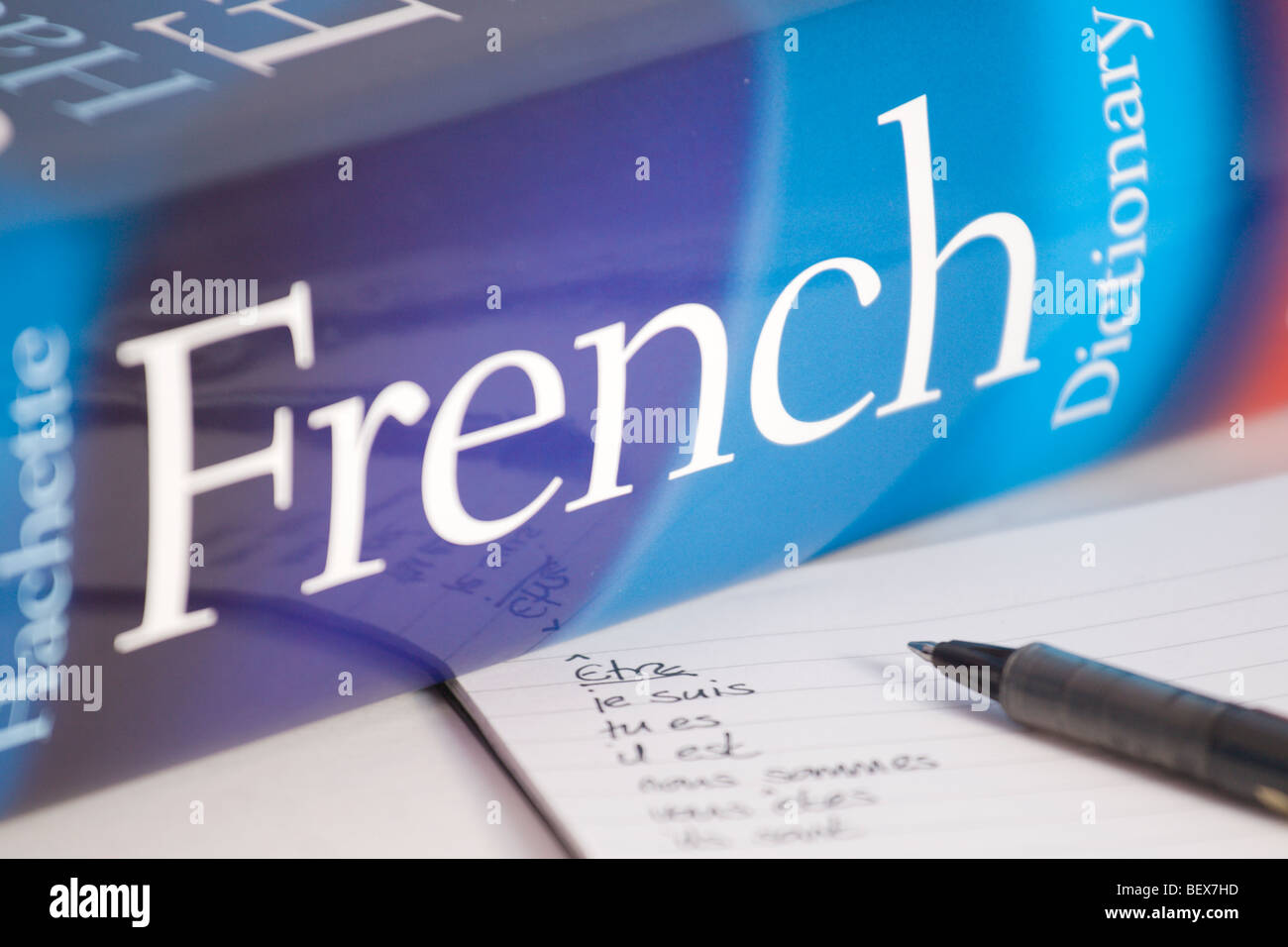 A french dictionary with pen and paper Stock Photo - Alamy