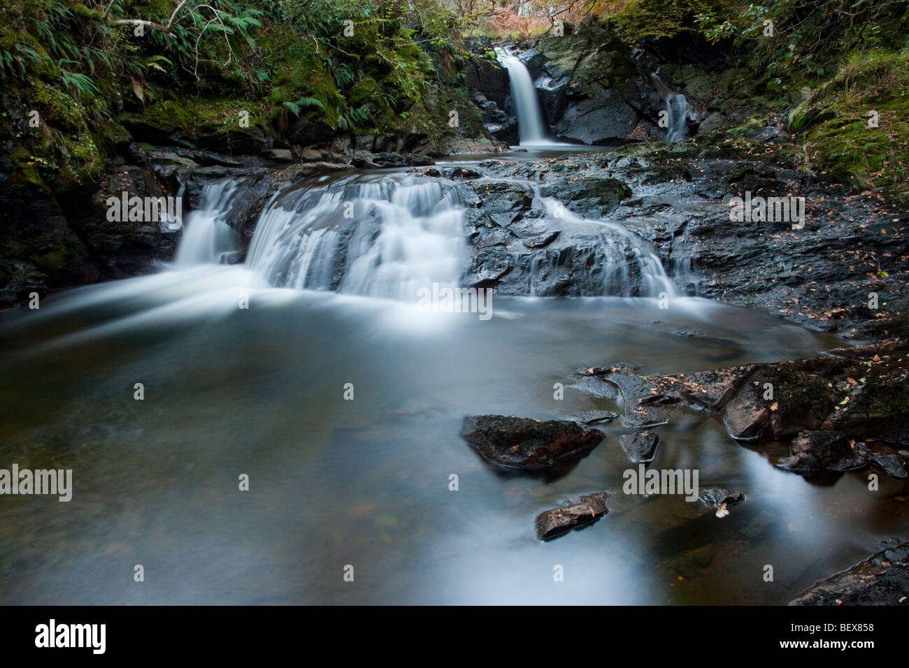 Flowing stream and waterfall Stock Photo - Alamy