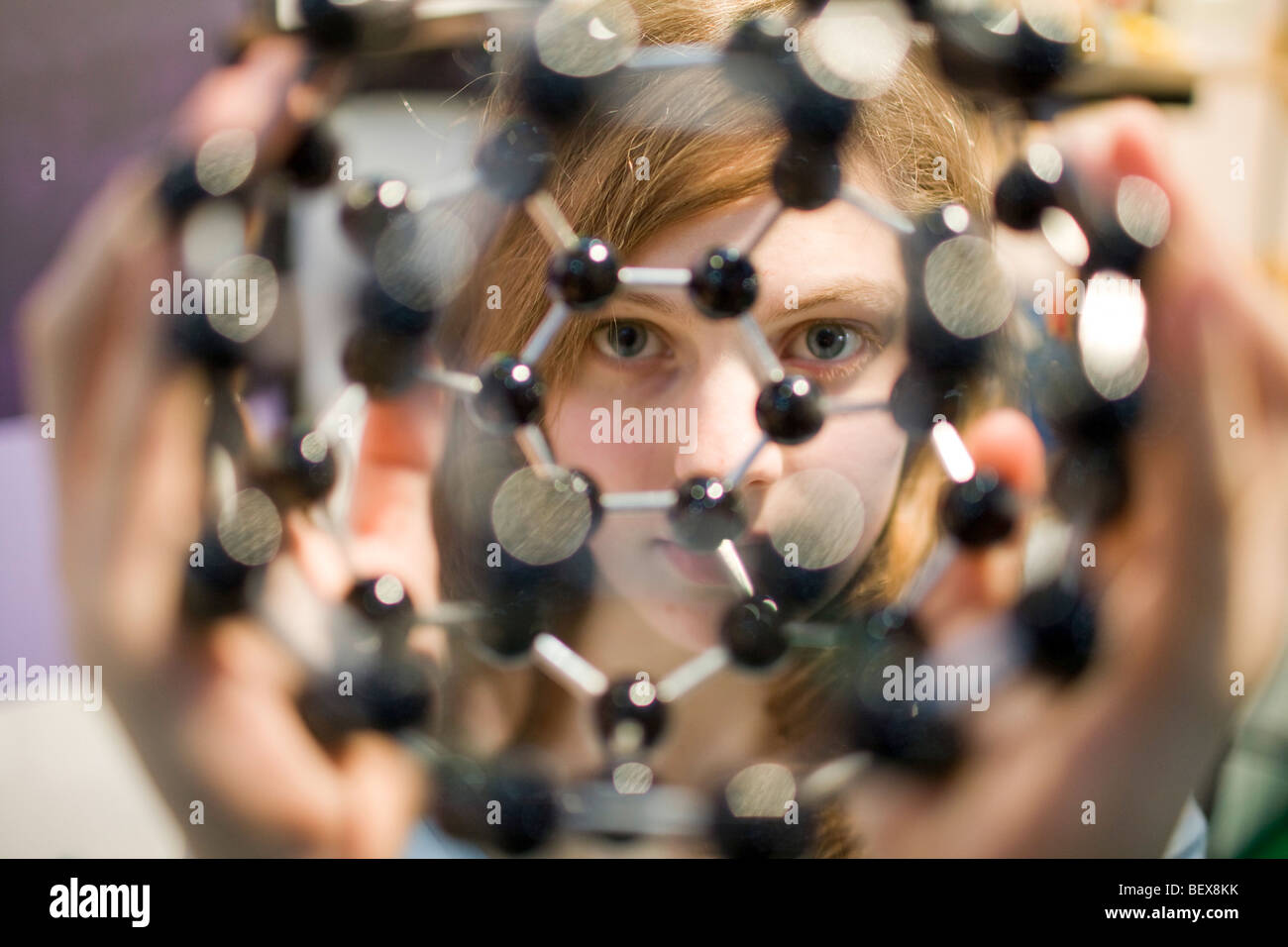 Student with a atom model Stock Photo - Alamy