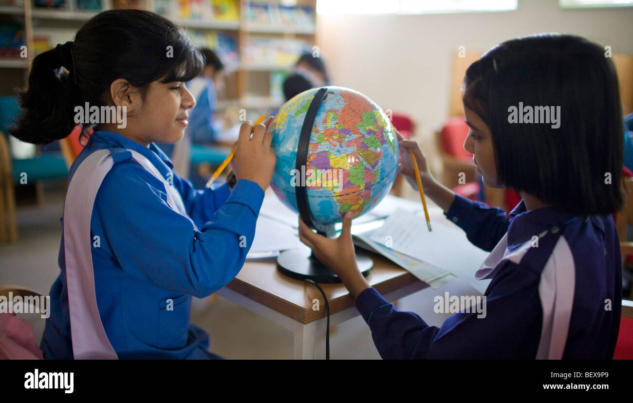 Students with a globe at class at National Book Foundation in Islamabad ...