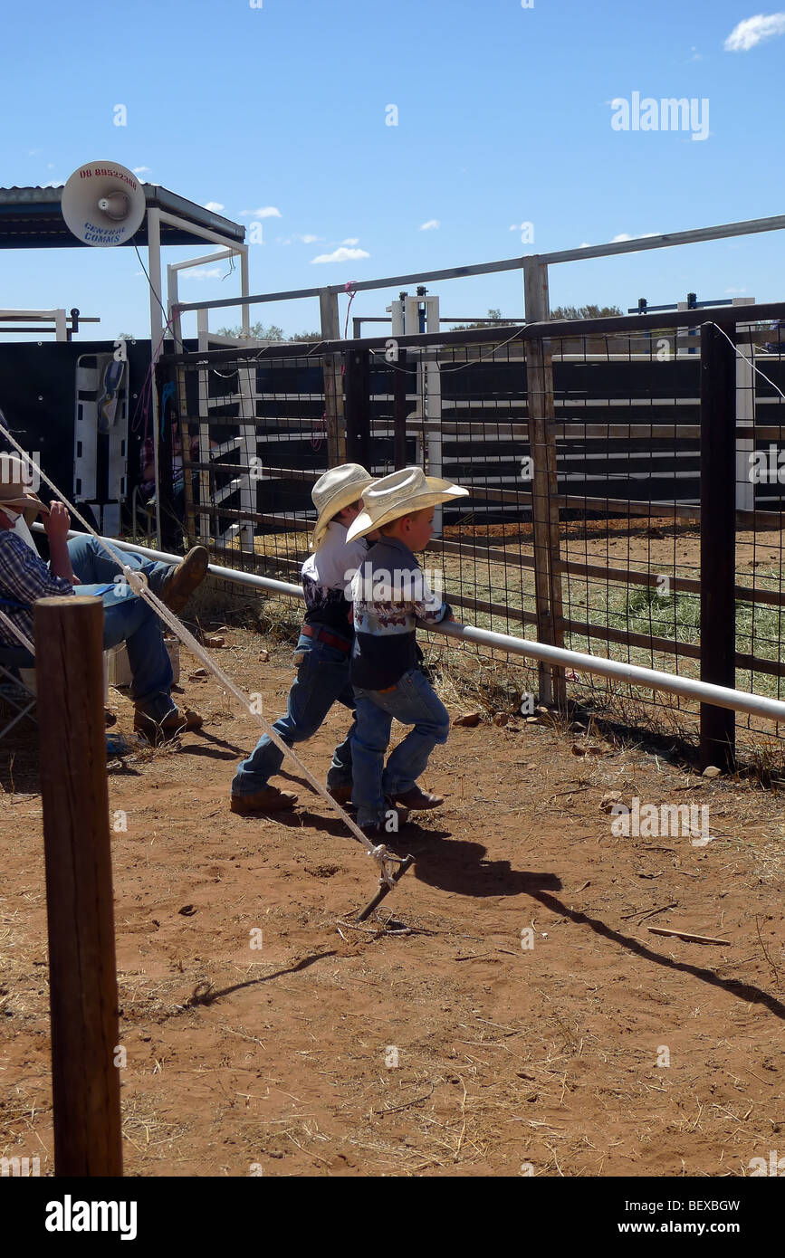 Two young cowboys watching a rodeo in the Australian Outback Stock ...