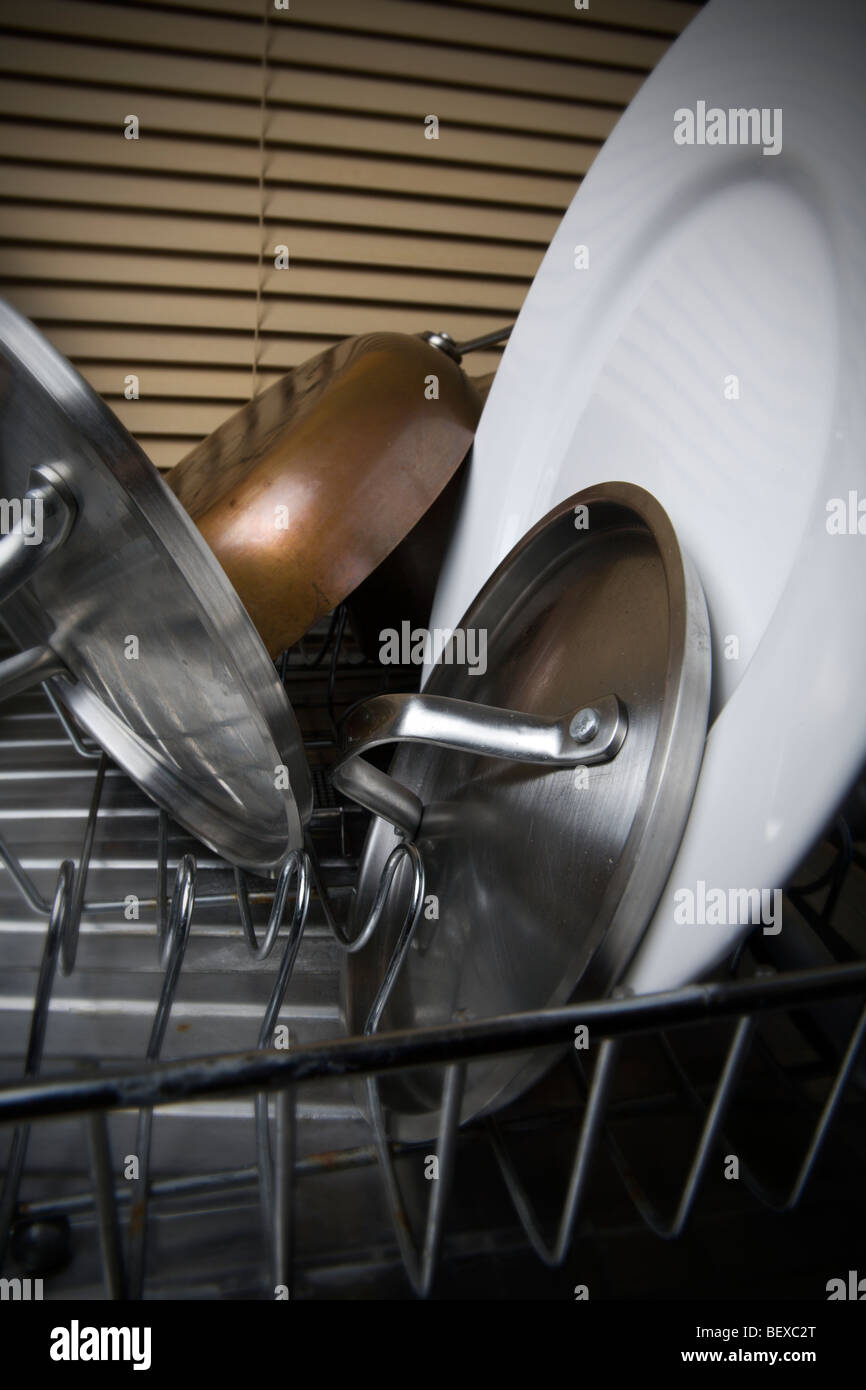 plate drying by the side of the sink Stock Photo - Alamy
