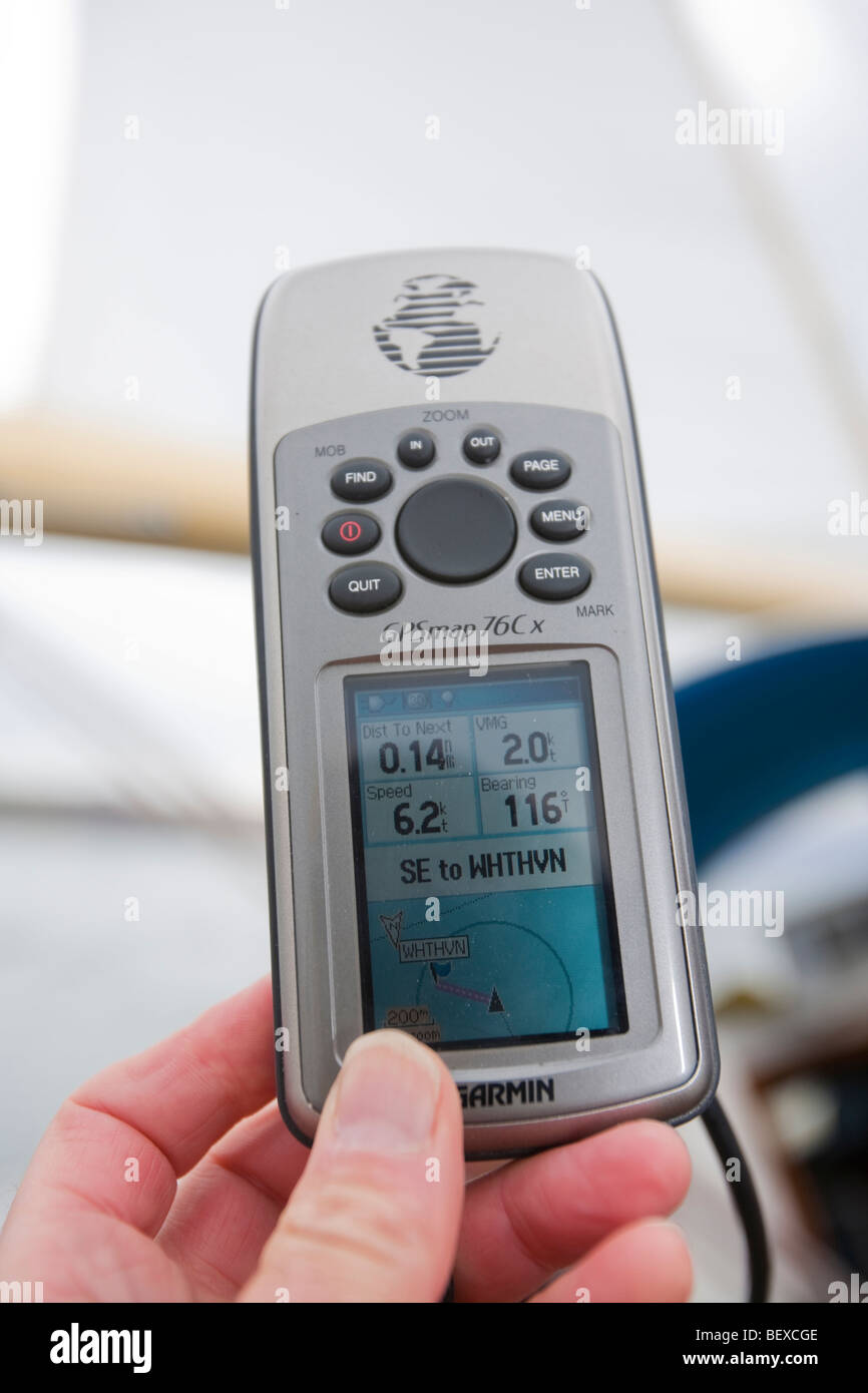 A sailor using a GPS on a sailing boat off the Cumbrian coast for ...
