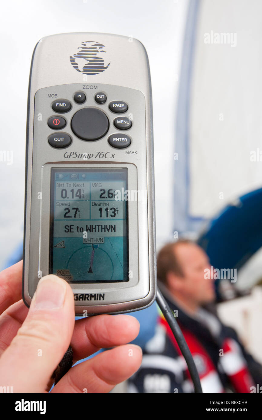 A sailor using a GPS on a sailing boat off the Cumbrian coast for ...