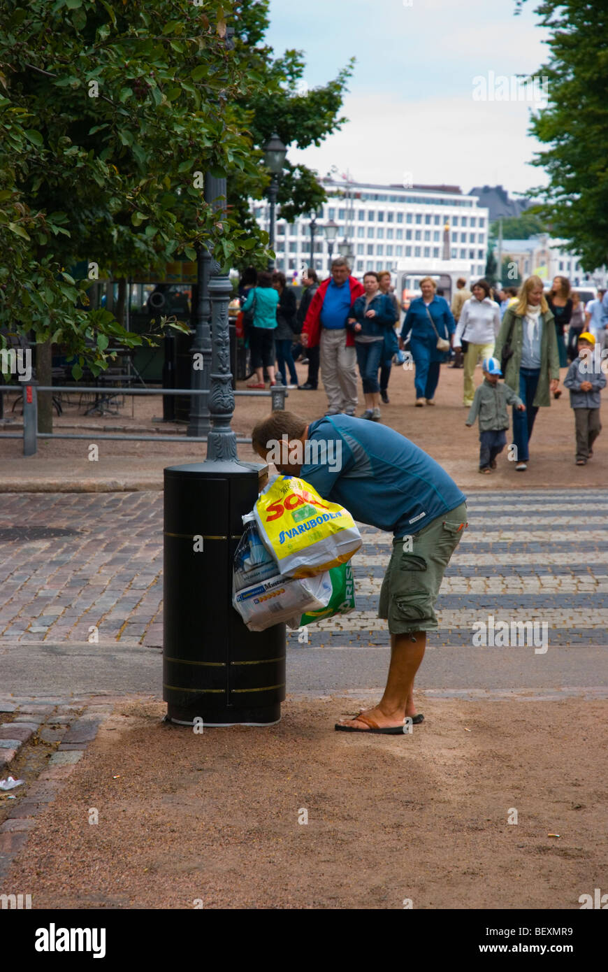 Man going through bins hi-res stock photography and images - Alamy