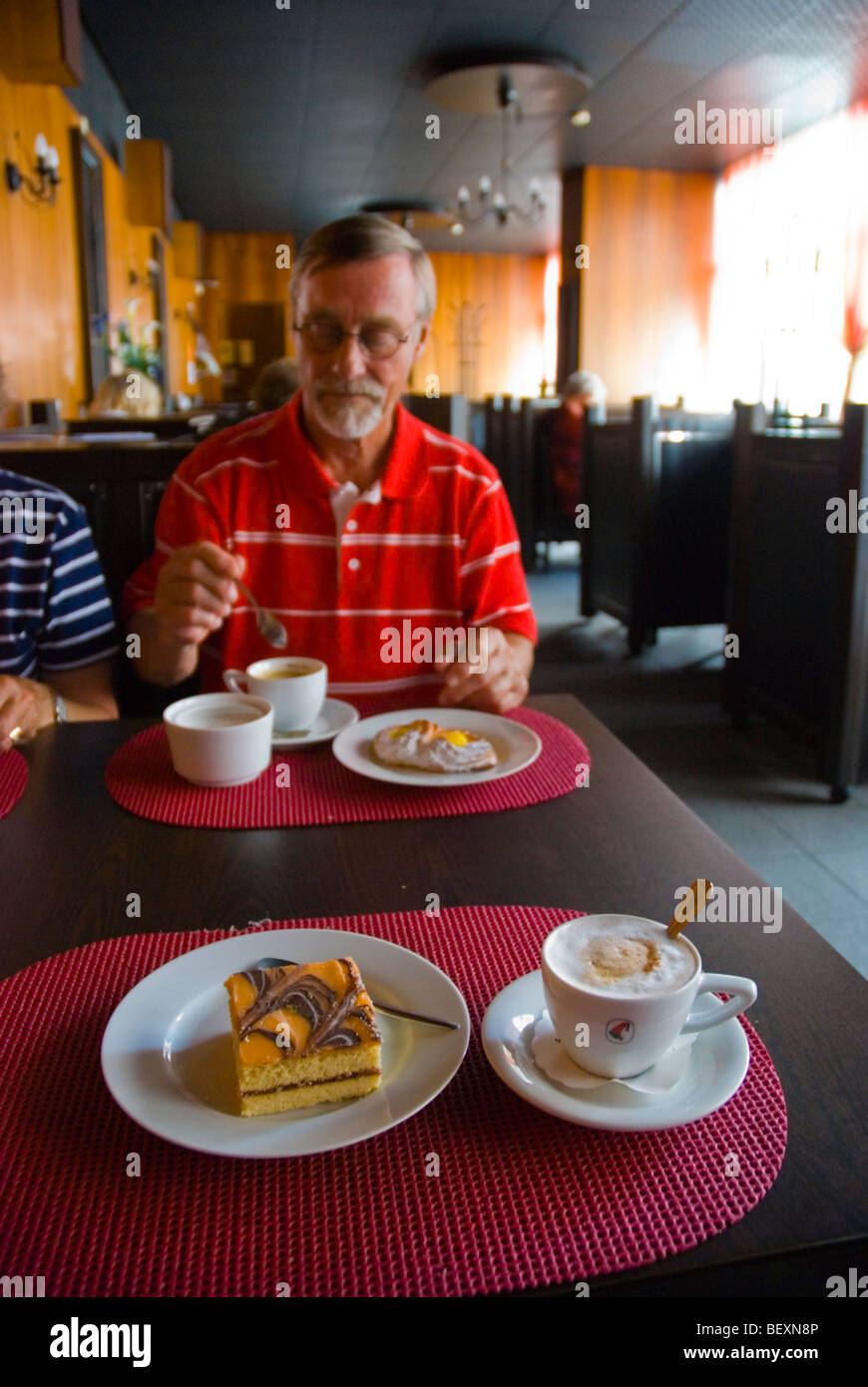 Senior man having coffee and cake Kohvik Narva the Soviet style cafe in ...