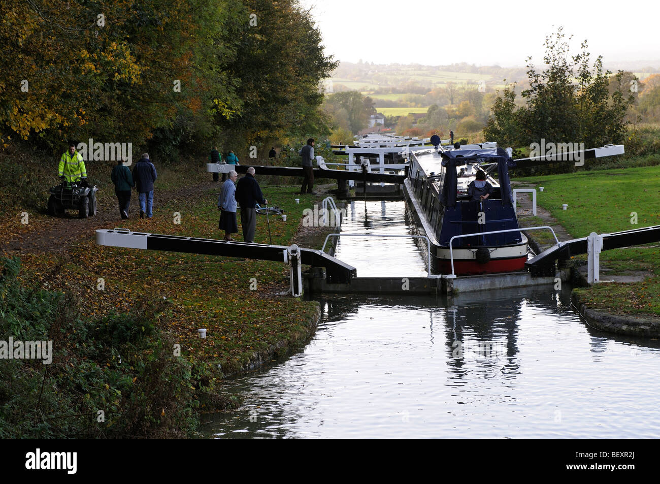 Autumn scene with canalboat passing through Lock 40 of the Kennet and ...