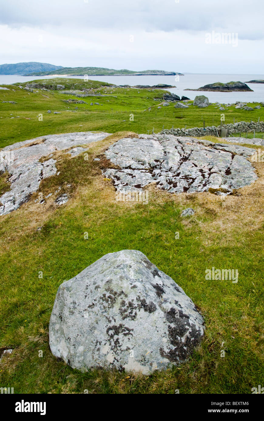 Old rocks in a bleak landscape on the west coast of the Isle of Lewis ...