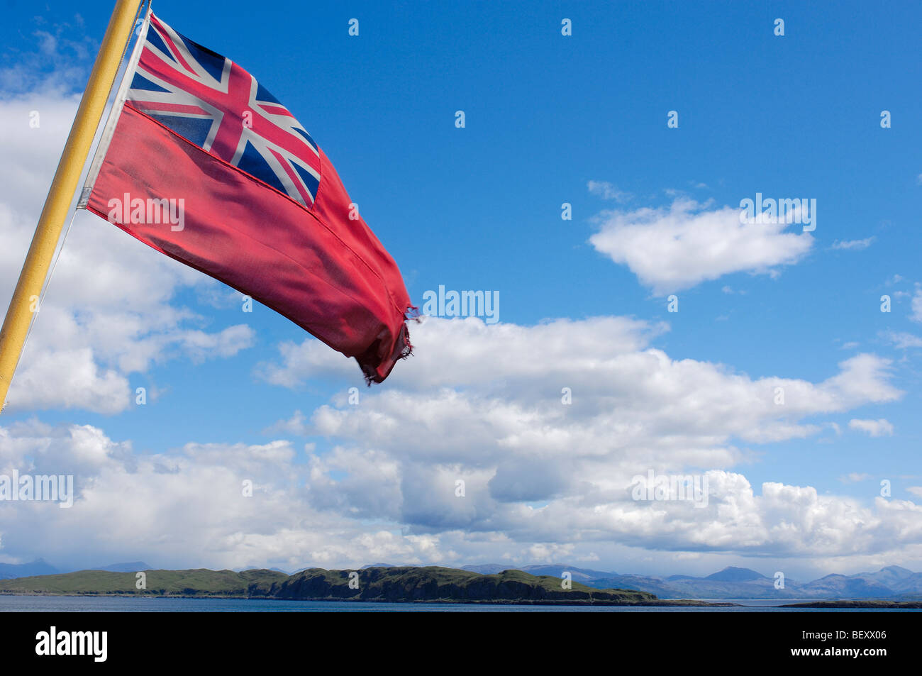 Red Ensign flag of the British merchant marine at Ferry tu Mull island ...