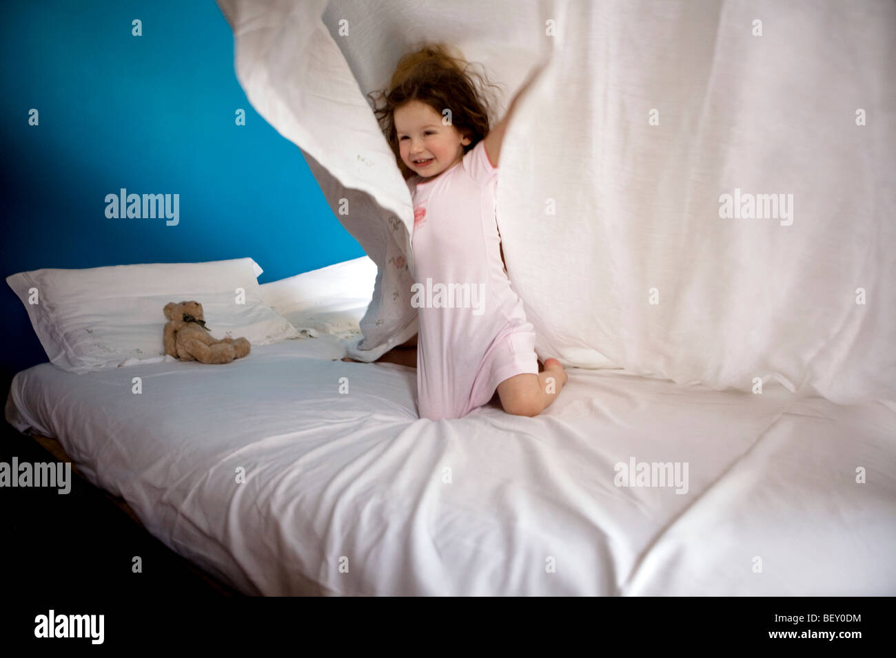 little girl playing with sheet Stock Photo - Alamy