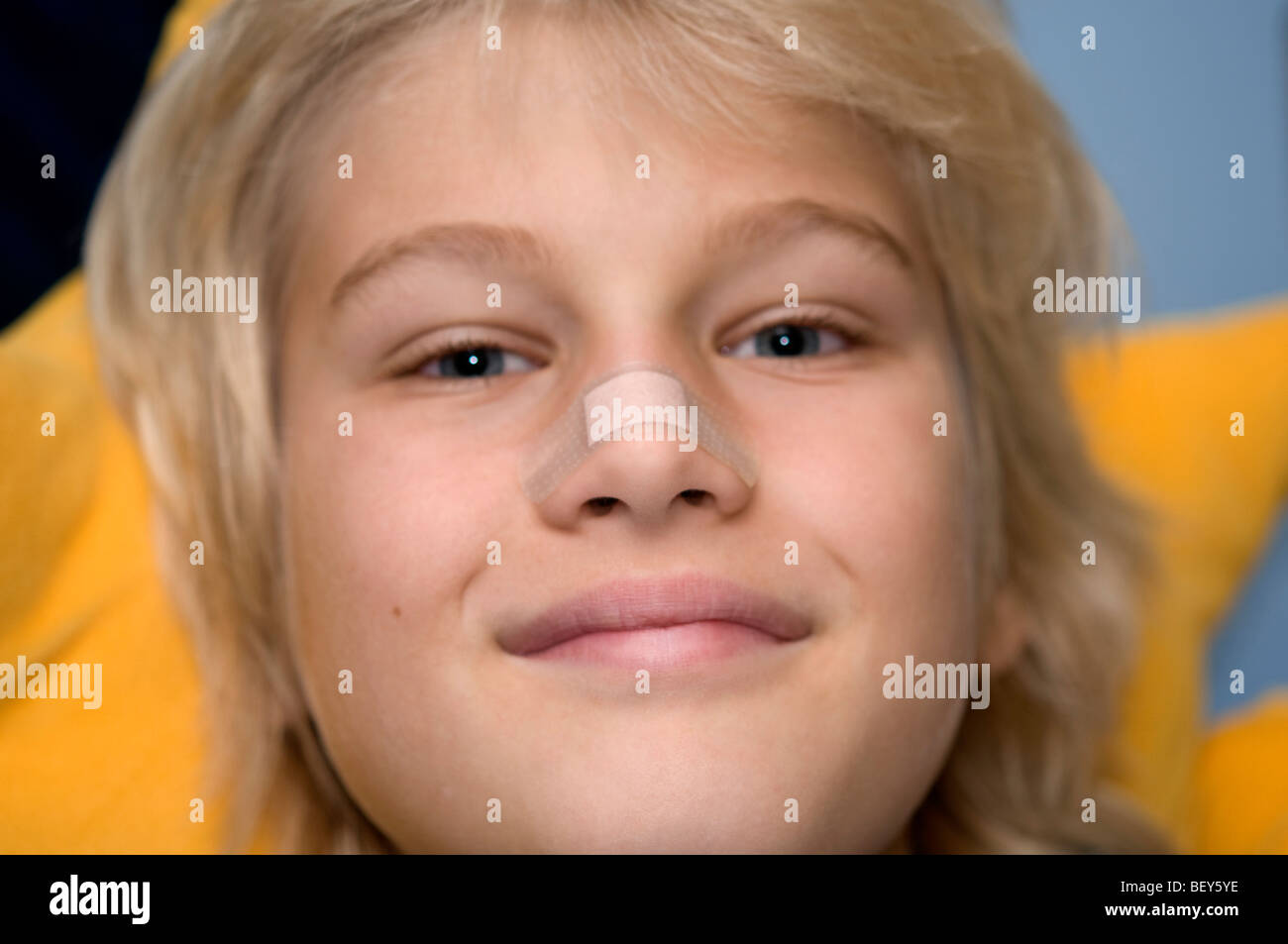 boy with plaster on the nose Stock Photo - Alamy