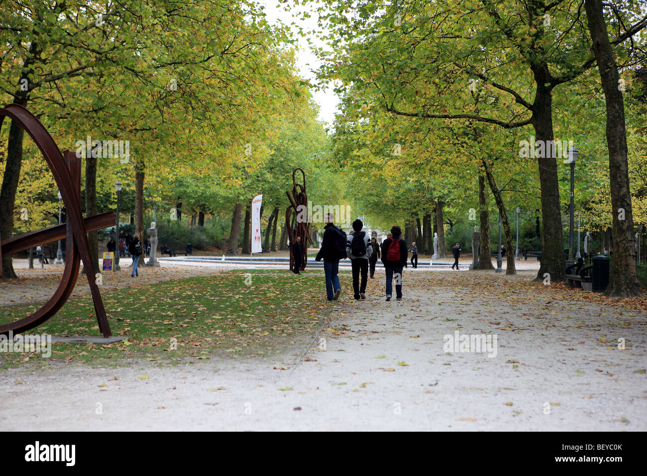 People wandering through Brussels Park which is the largest park in the ...
