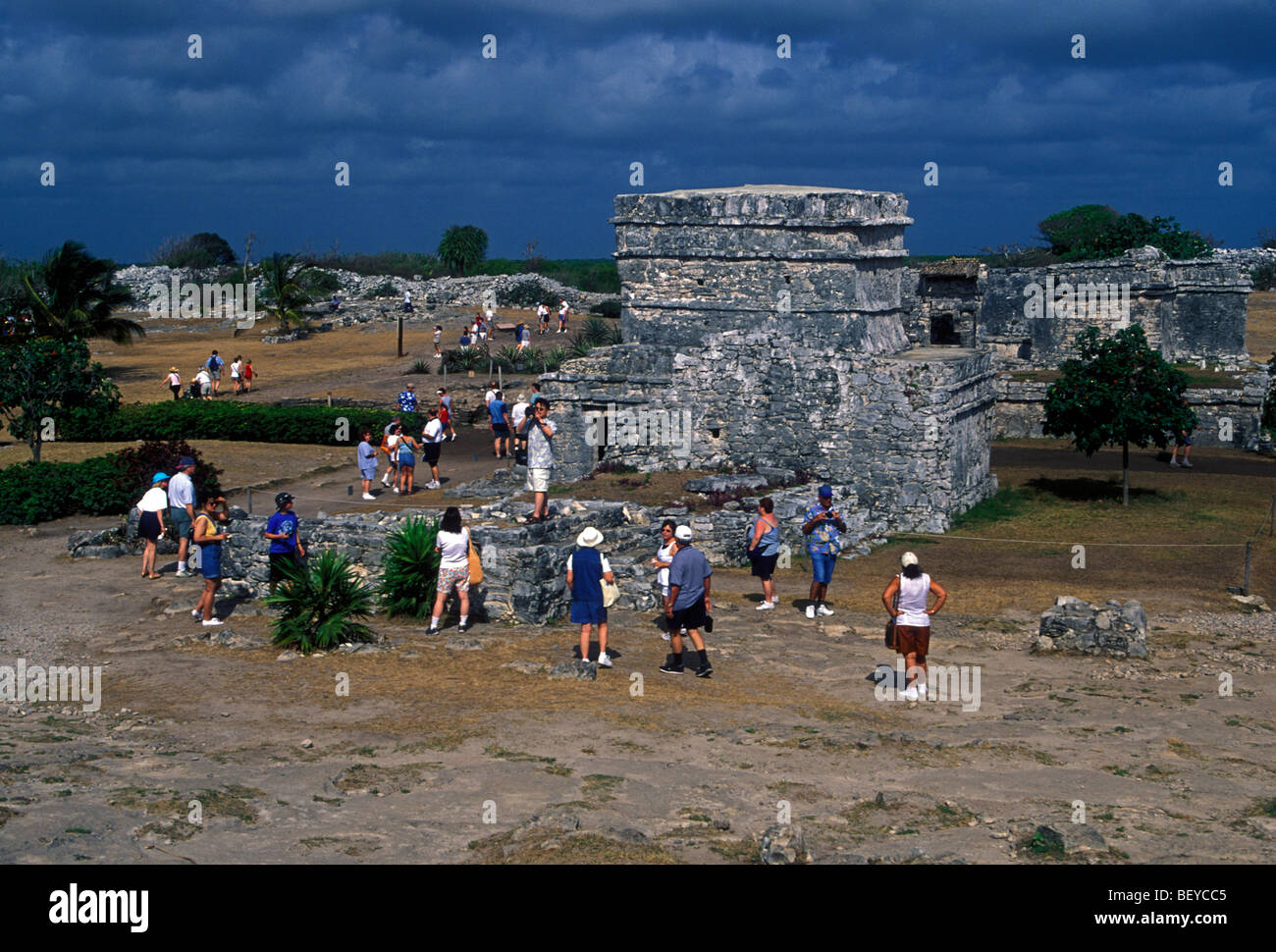 people tourists visiting pre-Columbian Mayan ruin Mayan ruins at Tulum ...