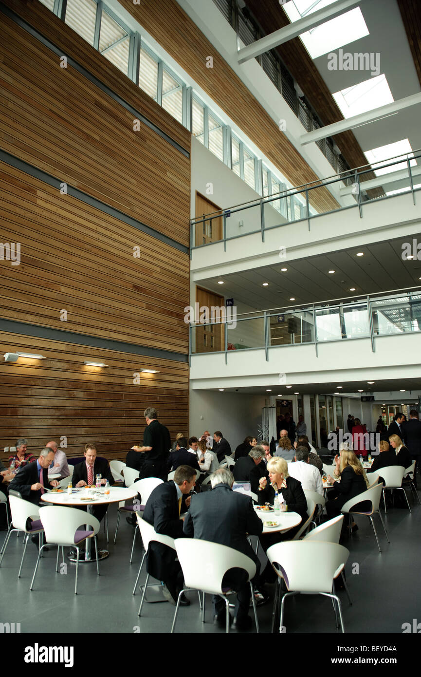 People having lunch in the atrium Inside the new Wales Assembly ...
