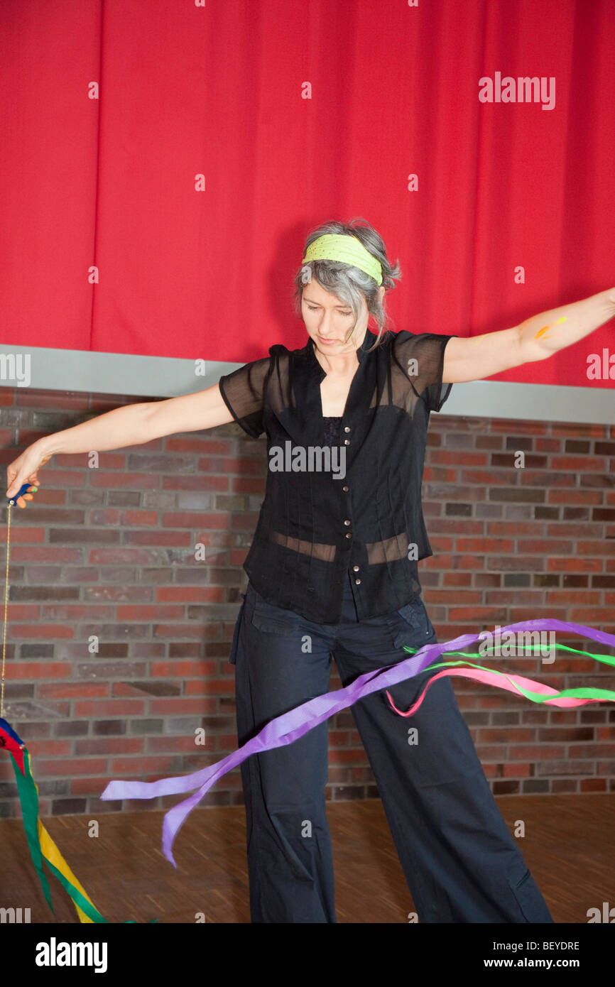 Circus Act - Mature Woman performing wih Ribbons Stock Photo - Alamy
