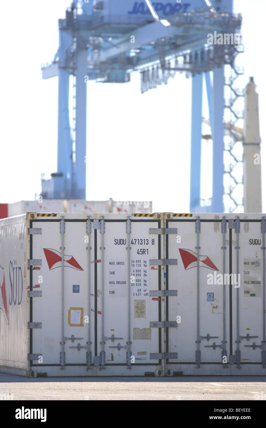 Loading containership in port Stock Photo - Alamy