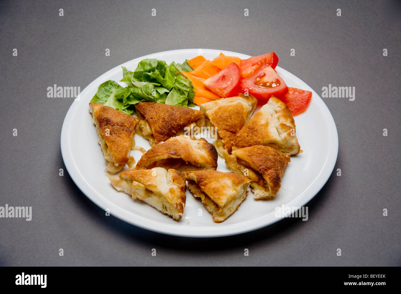 A calzone is an Italian turnover made from pizza dough and stuffed with ...