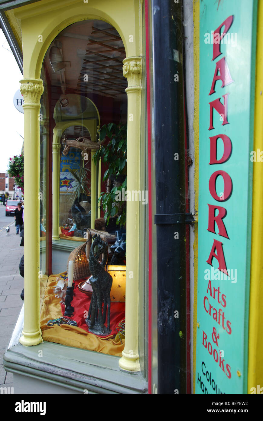 Colourful shop fronts in Glastonbury High Street Somerset England Stock ...