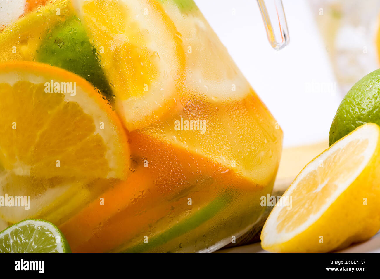 Summer drink. Orange and carafe with citrus ice water Stock Photo - Alamy