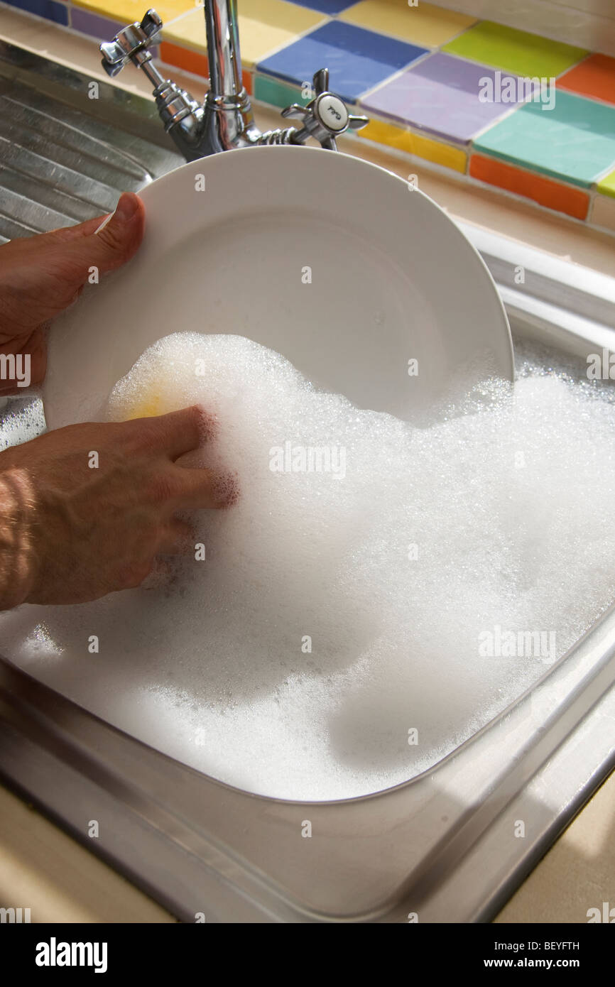 A man washing up Stock Photo - Alamy