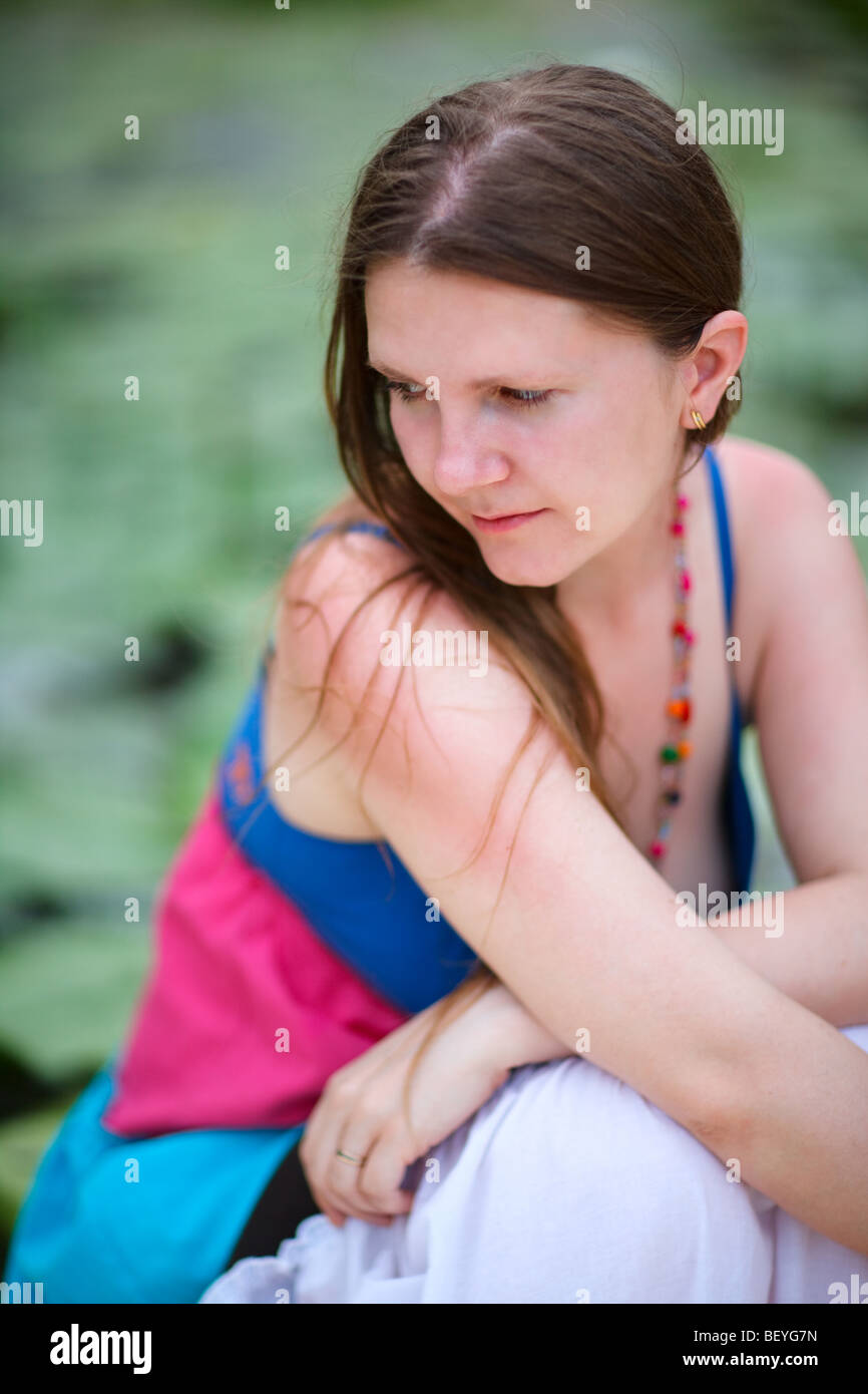 Lifestyle portrait of young beautiful woman outdoors Stock Photo - Alamy