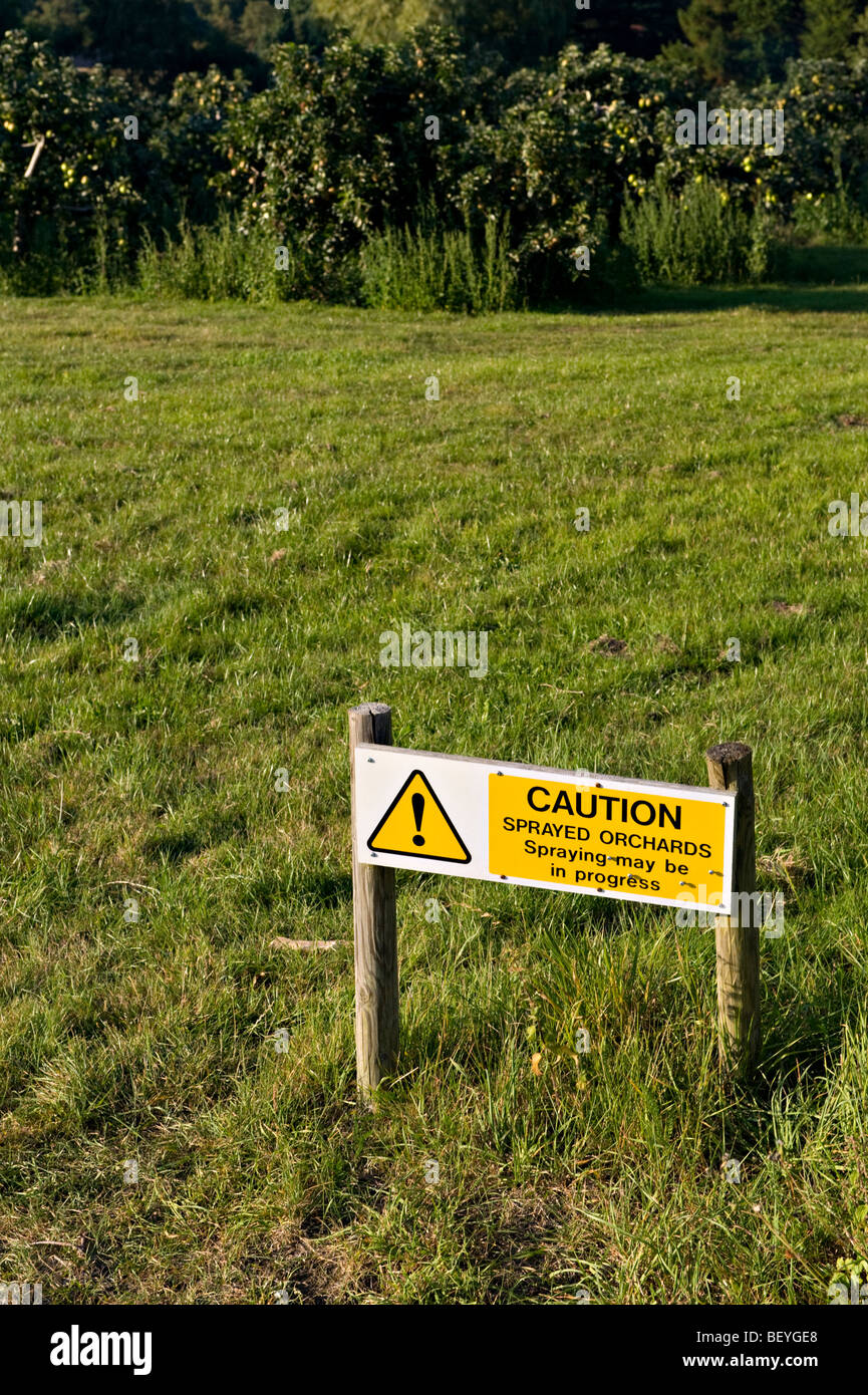 Sign warning of sprayed crops in a Kentish orchard Stock Photo - Alamy