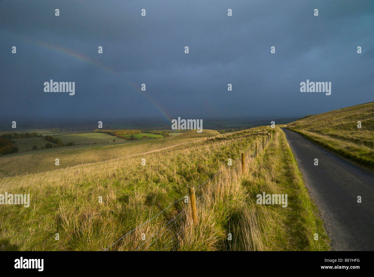 A rainbow over the White Horse vale near Uffington castle hillfort UK ...