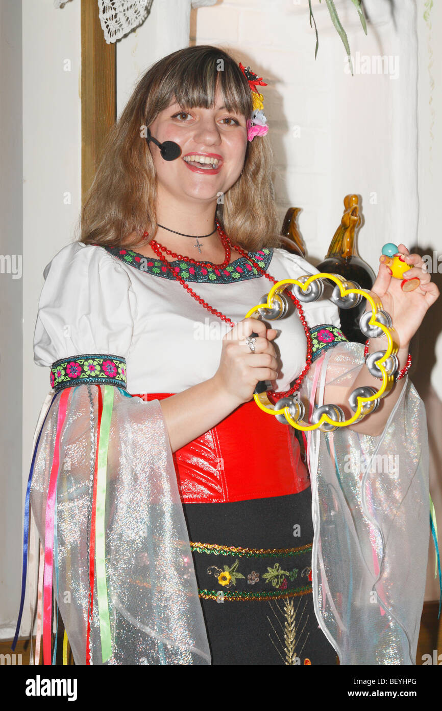 Young & beautiful Ukrainian Folk song singer lady is performing in a ...