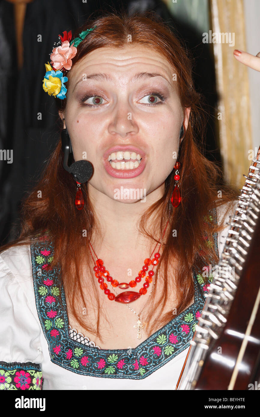 Young & beautiful Ukrainian Folk song singer lady is performing in a ...