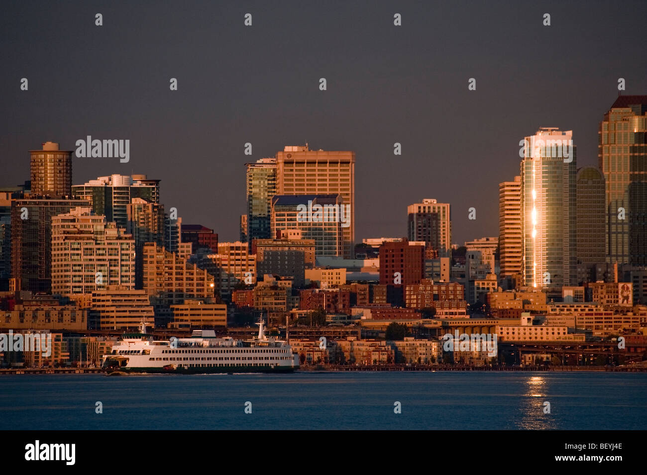 The Seattle skyline taken at sunset. Elliott Bay and the ferry boats ...