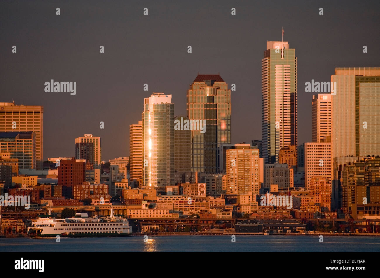 The Seattle skyline taken at sunset. Elliott Bay and the ferry boats ...