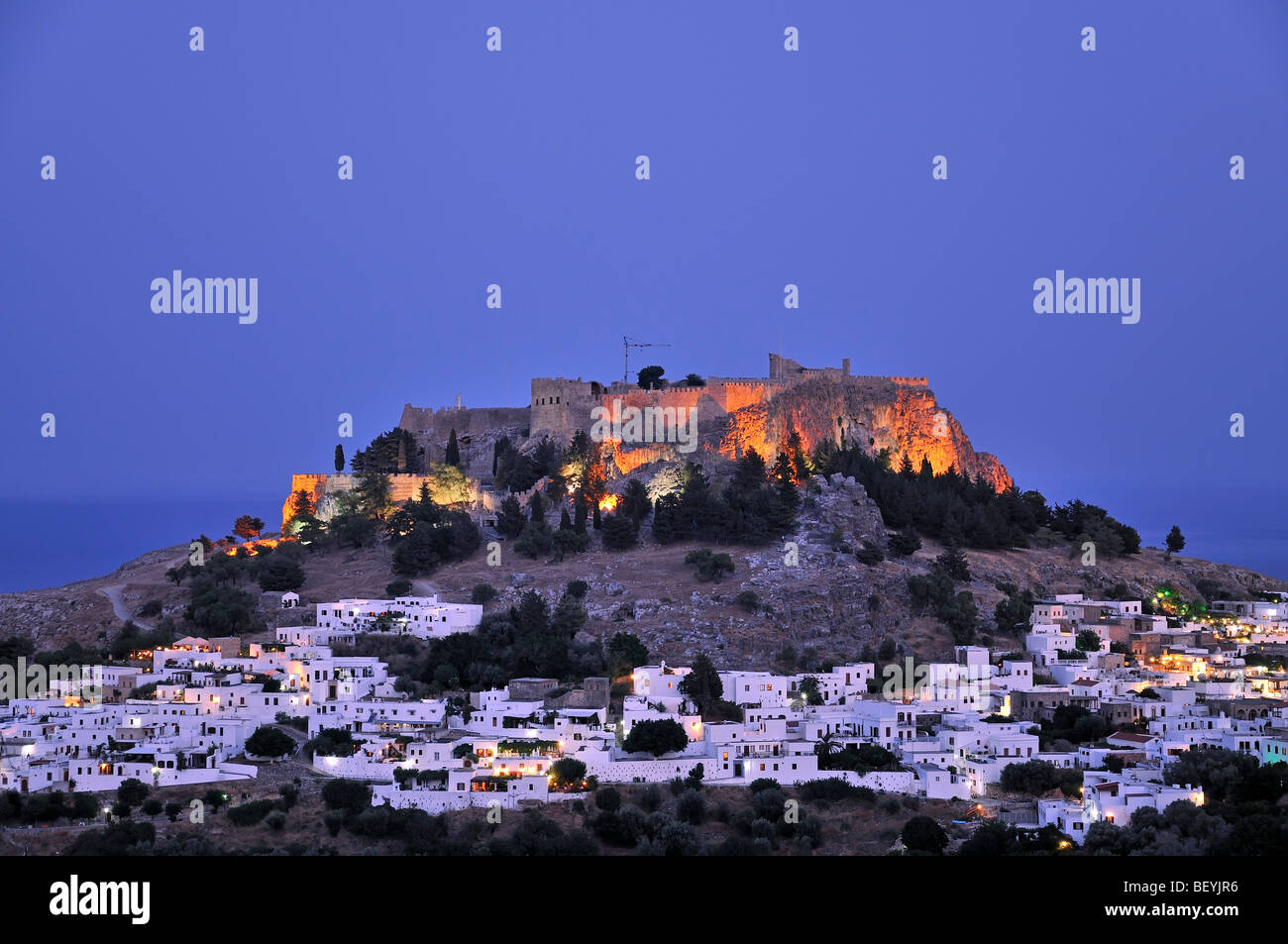 Acropolis and village of Lindos by night, Rhodes island, Greece Stock ...