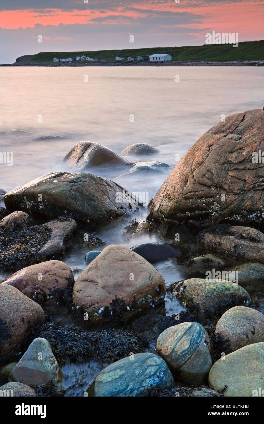 The rocky shoreline of Green Point at sunset, Gros Morne National Park ...