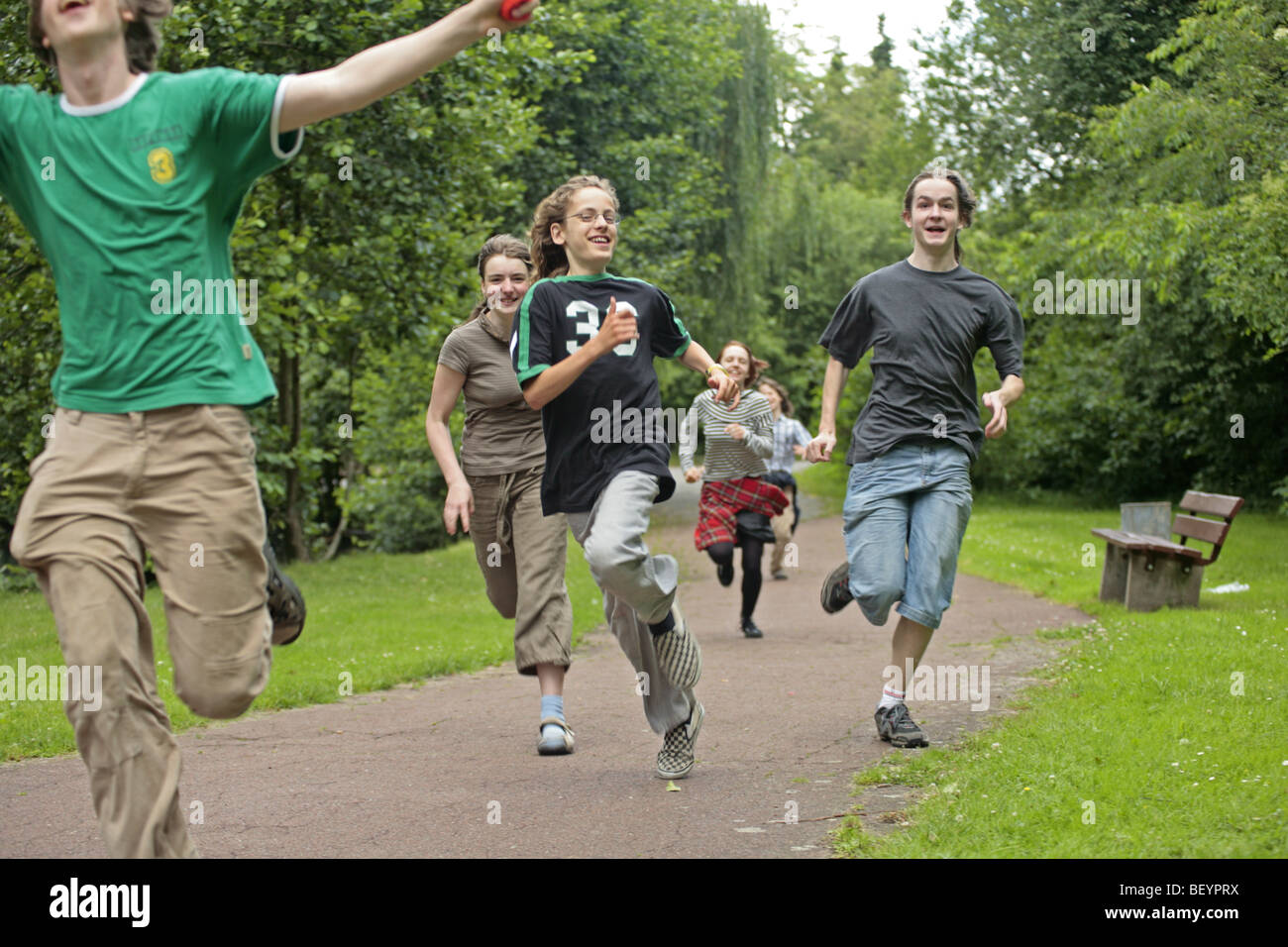 teenagers having a [racing duel] at a park Stock Photo - Alamy