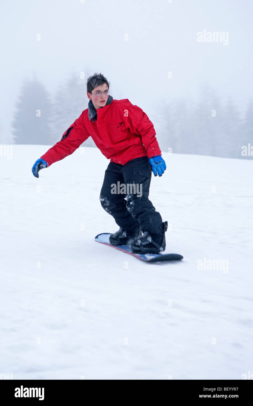 teenage boy snowboarding Stock Photo - Alamy