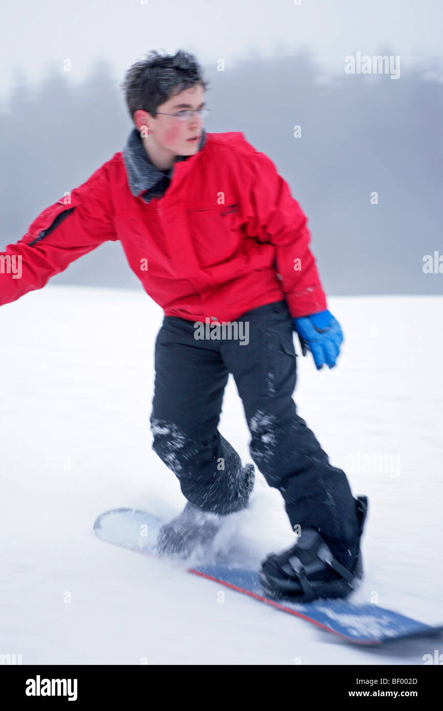 teenage boy snowboarding Stock Photo - Alamy